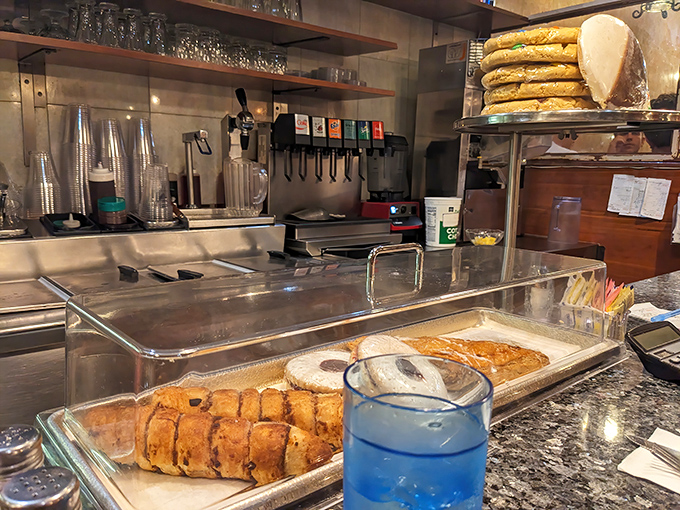 Behind-the-scenes kitchen action where breakfast magic happens with professional precision and genuine care.