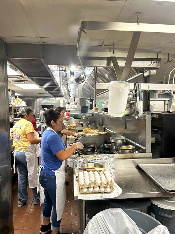 The kitchen ballet&mdash;where short-order magic happens. Those hands have flipped more pancakes than most of us have had hot breakfasts.