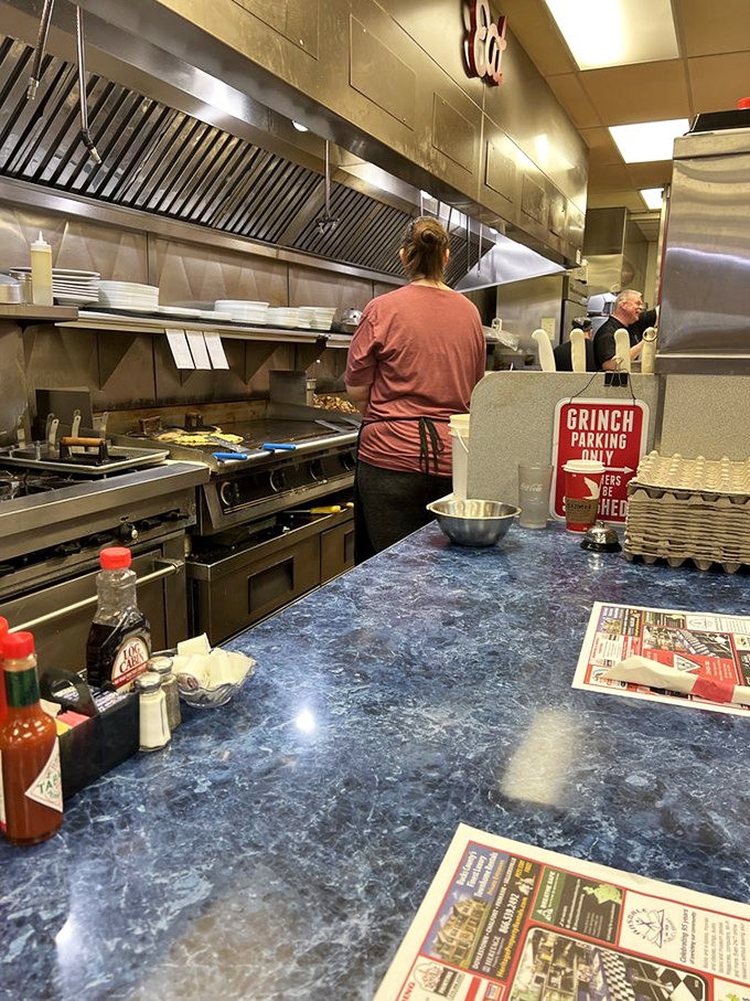 Behind the scenes magic where short-order wizardry happens. That "Grinch Parking Only" sign tells you everything about the humor here.