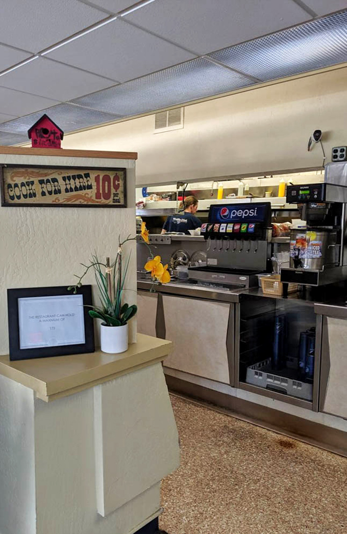 That "Cook For Hire 10&cent;" sign tells you everything about the playful spirit behind this serious food operation.