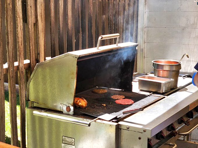 Where the magic happens. This outdoor grill station proves that sometimes the simplest cooking methods yield the most spectacular results.
