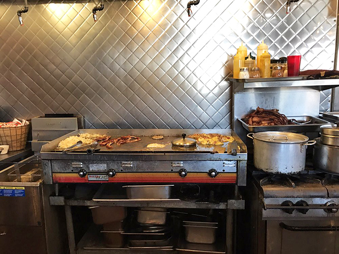 Behind the diamond-pattern backsplash lies the beating heart of Nadine's &ndash; a kitchen where breakfast magic happens without smoke, mirrors, or pretension.