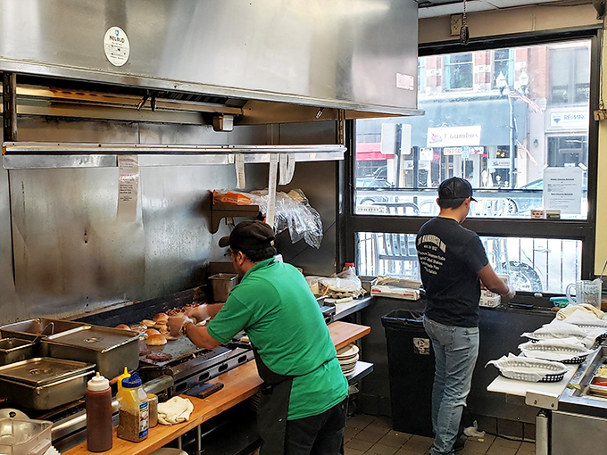 The kitchen ballet—where short-order cooking becomes performance art. These maestros of the flat-top orchestrate breakfast symphonies with spatula batons.