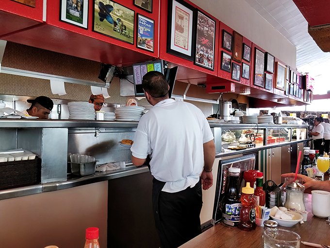 The open kitchen design lets you witness the choreographed chaos that somehow results in plate after plate of comfort food perfection.