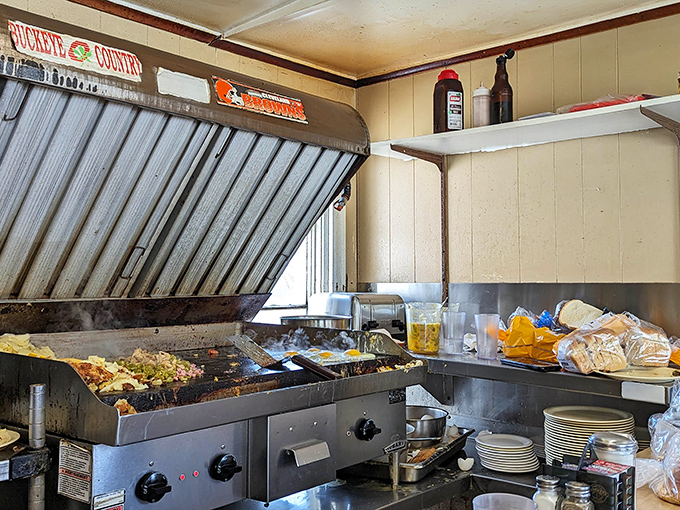 The well-seasoned flat-top grill&mdash;where breakfast magic happens and decades of flavor have seasoned every square inch.