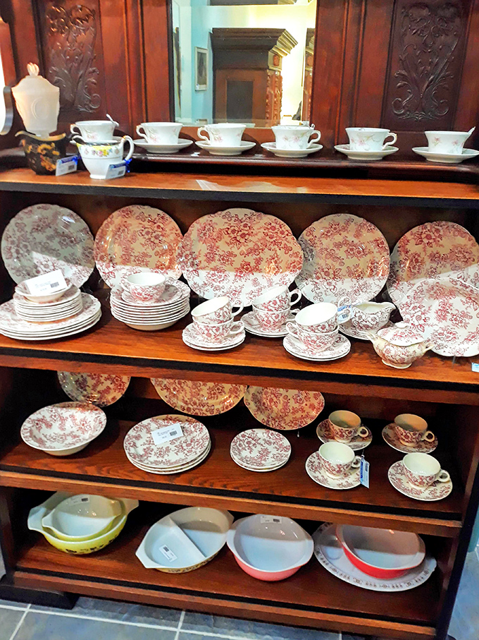 Complete china sets wait patiently for their next chapter. These dishes have served countless meals and are ready for countless more.