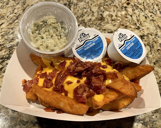 Loaded potato wedges topped with cheese and bacon&mdash;because sometimes fries need to dress up for special occasions.