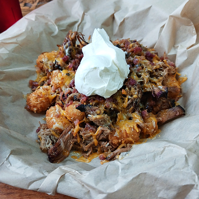 Loaded tots that laugh in the face of moderation &ndash; a mountain of potatoes, meat, and cheese that requires both a fork and a strategy.