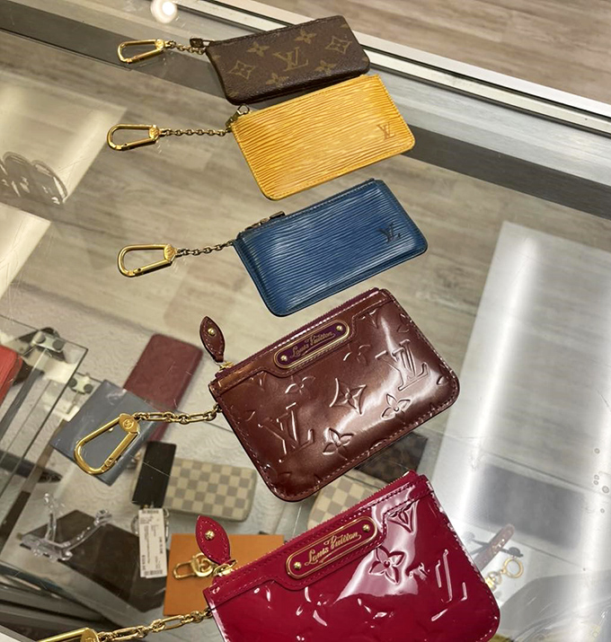 Louis Vuitton pouches dangling like fashionable fruit, ripe for the picking at unbelievable prices.