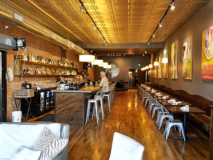 Lula's Louisiana Cookhouse brings unexpected sophistication to small-town dining, where exposed brick meets golden ceilings and craft cocktails.