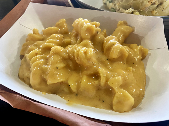 Mac and cheese that flows like liquid gold. This isn't your childhood boxed version—this is the grown-up, indulgent comfort we all deserve.