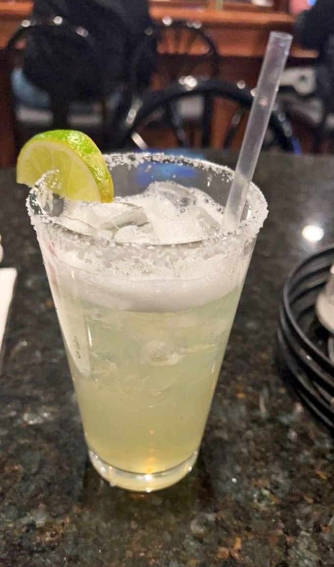 A margarita with a salt rim so perfect it deserves its own toast. This isn't just a drink&mdash;it's vacation in a glass.