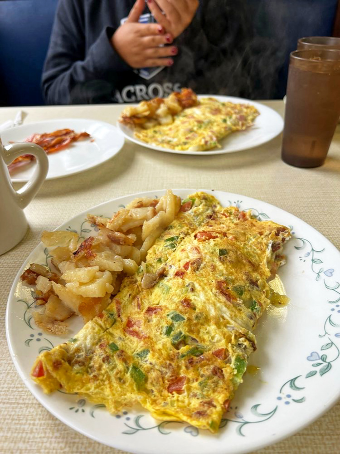 An omelet stuffed with such generous fillings it makes you wonder if eggs have some secret capacity-expanding superpower we've never fully appreciated.
