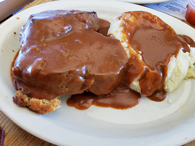 Meatloaf and mashed potatoes swimming in gravy&mdash;the kind of plate that makes you want to hug whoever's in the kitchen.