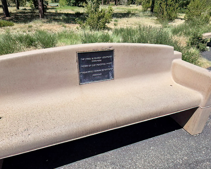 A simple memorial bench offers the best seat in the house, inviting weary travelers to sit a spell and contemplate nature's masterpiece.