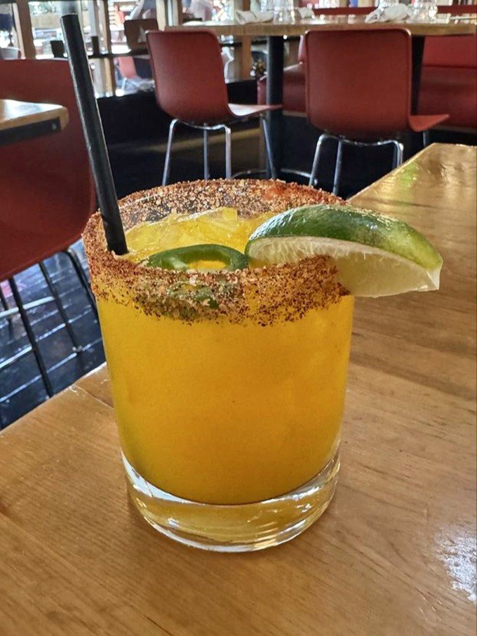 This sunshine-colored cocktail with its spiced rim and lime garnish offers a California twist on classic cocktail traditions&mdash;refreshing and camera-ready.