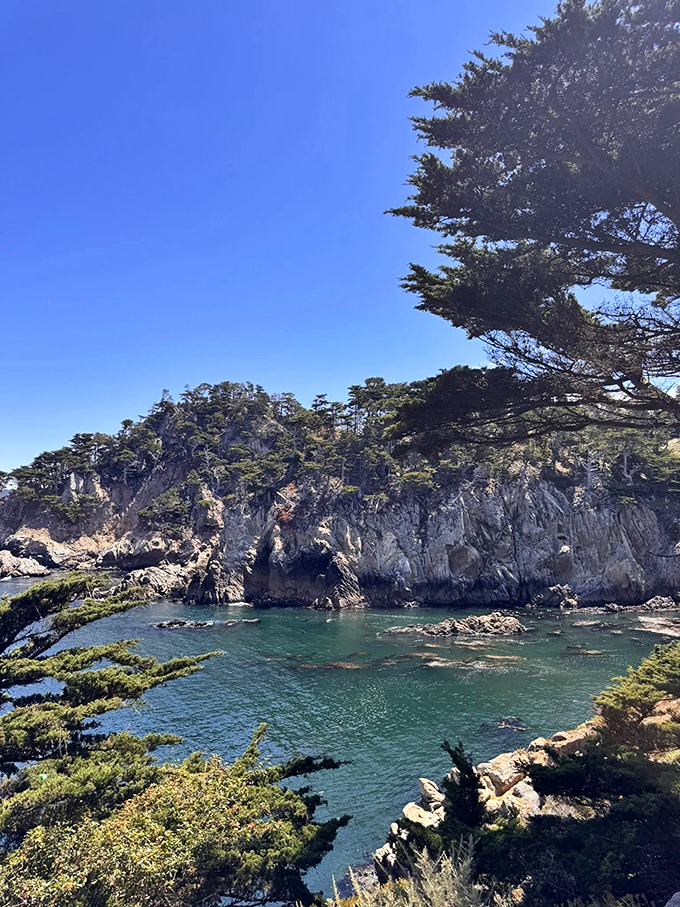 Cliffs stand sentinel over turquoise waters in a display so perfect it looks Photoshopped. Mother Nature showing off her best work without apology.
