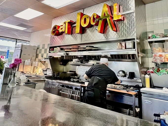 In the open kitchen, breakfast alchemy happens before your eyes, turning simple ingredients into gold medal-worthy morning fare.