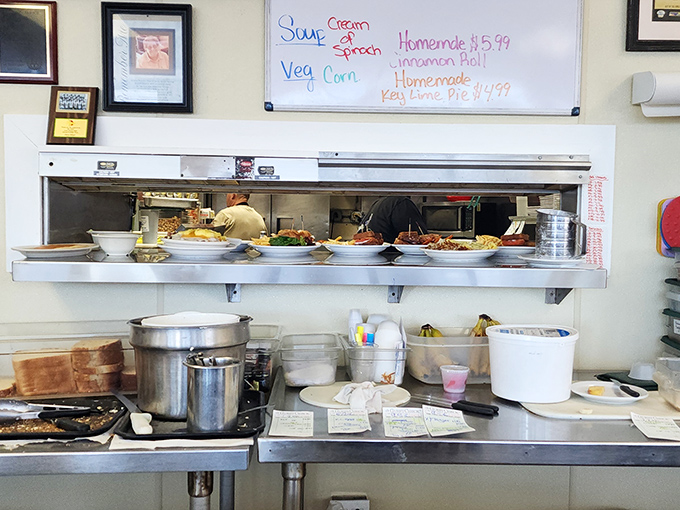 The open kitchen and specials board—where soup, cinnamon roll, and homemade Key lime pie dreams come true.