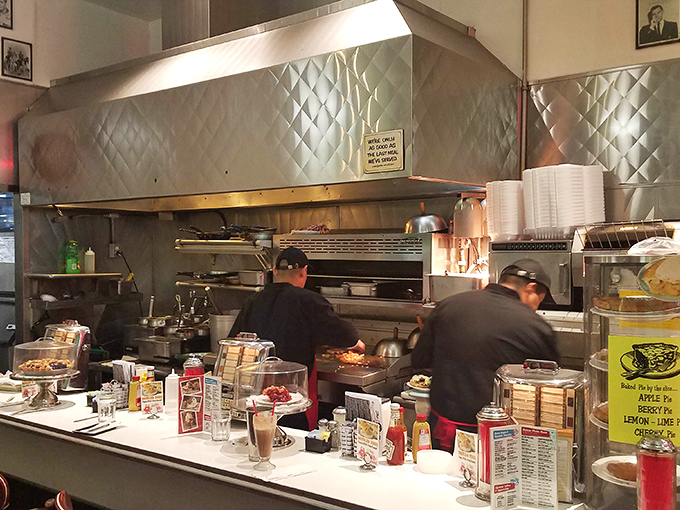 The open kitchen reveals the choreography of short-order cooking—a ballet of spatulas and sizzling grills that's been perfected over decades.