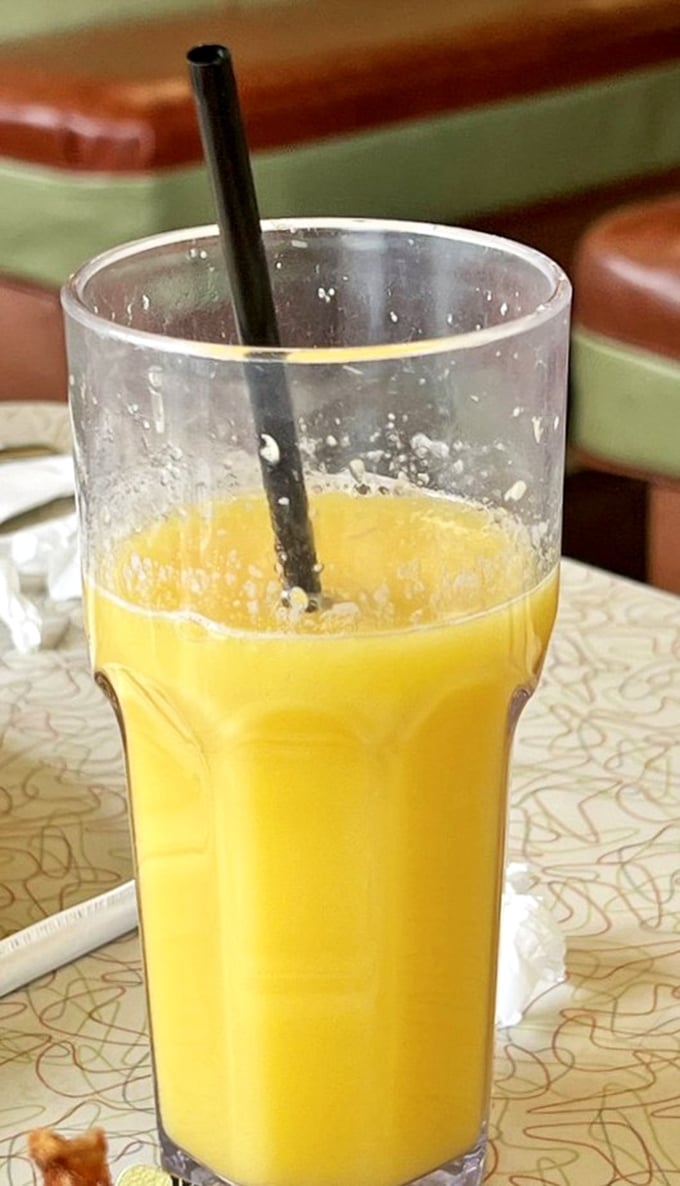 Fresh-squeezed orange juice so vibrant it practically glows. Morning sunshine in a glass, no filter needed.