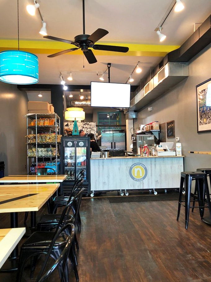 Where sandwich magic happens—the ordering counter beckons with possibilities. That logo promises good things are coming to those who order.