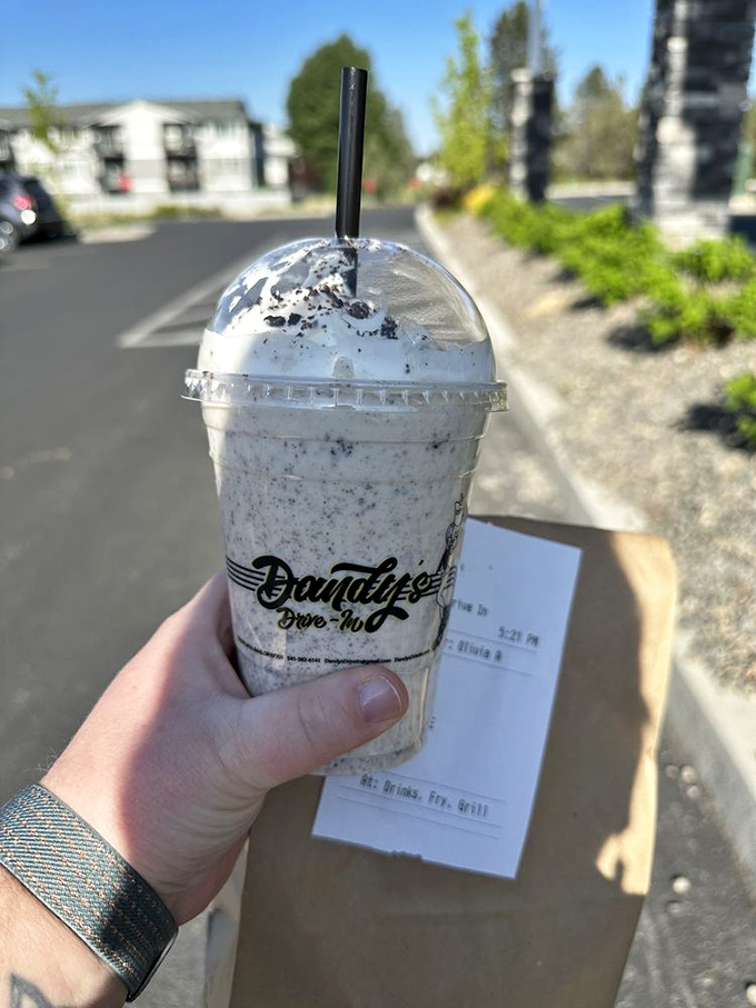 An Oreo malt so thick and creamy it practically requires construction equipment to drink through that straw.