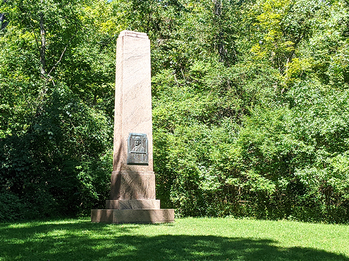 This stone monument stands as a silent storyteller, reminding visitors that this land's history runs deeper than its limestone gorges.