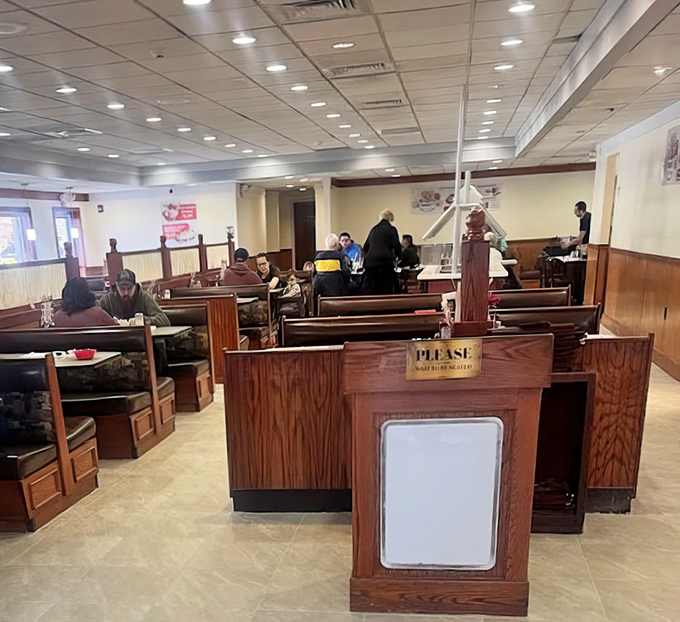 Wooden booths create intimate dining spaces where countless conversations, celebrations, and everyday meals have unfolded over the years.