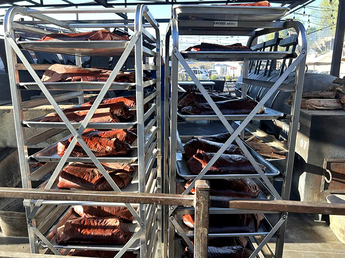 Racks of meat awaiting their smoky transformation – patience is the secret ingredient you can't buy but can definitely taste.