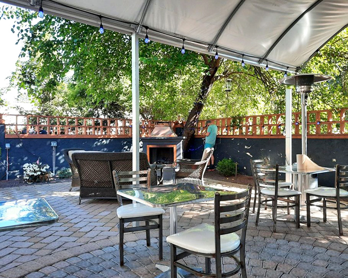 The outdoor patio offers a breath of fresh air between bites of smoky goodness. Brick pavers and shade make this the perfect spot for summer BBQ sessions.