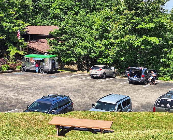 The parking area might seem ordinary, but it's actually the gateway to extraordinary adventures. Even food trucks know where the action is!