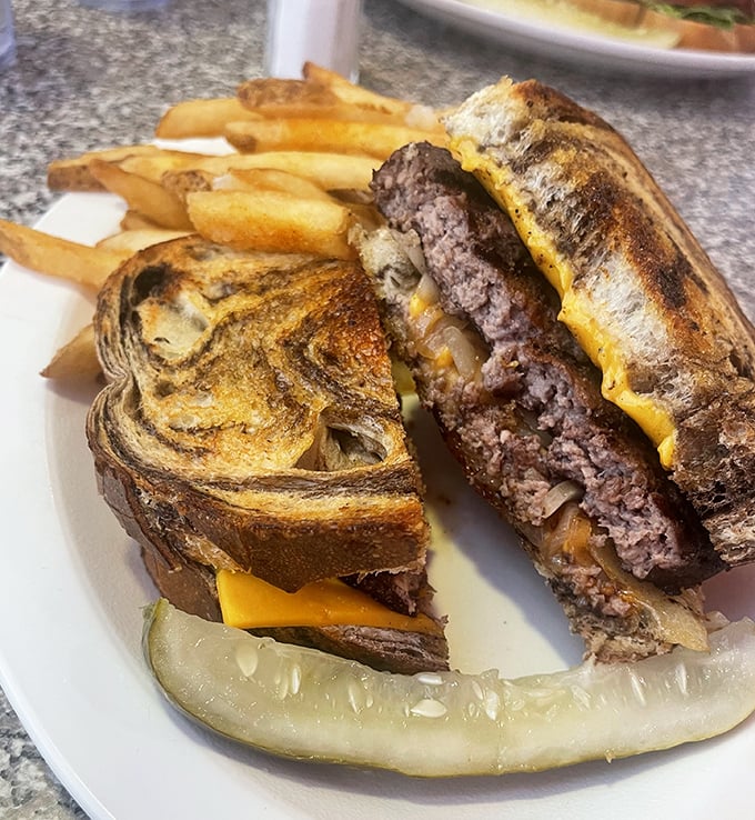 The patty melt&mdash;burger's sophisticated cousin&mdash;where grilled bread meets melted cheese in a symphony that makes you forget fancy dining exists.