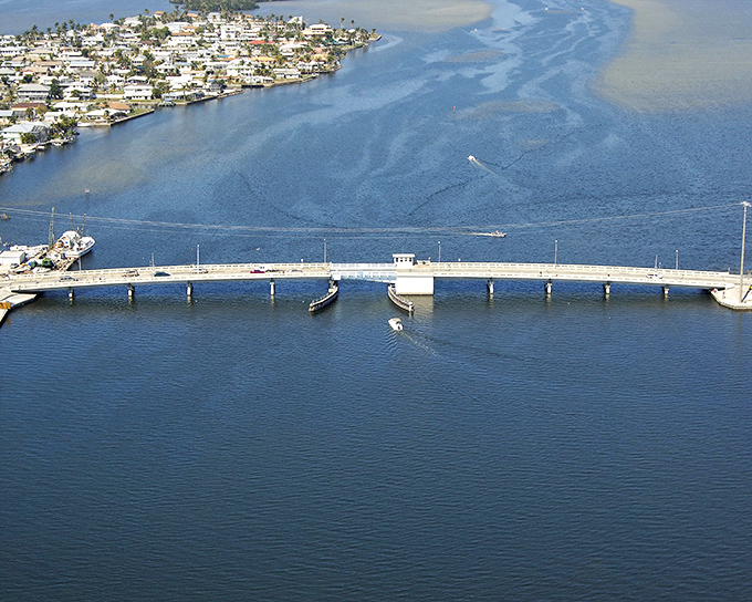 The Pine Island Bridge isn't just infrastructure &ndash; it's the gateway between mainland hustle and island time, a literal crossing into relaxation.