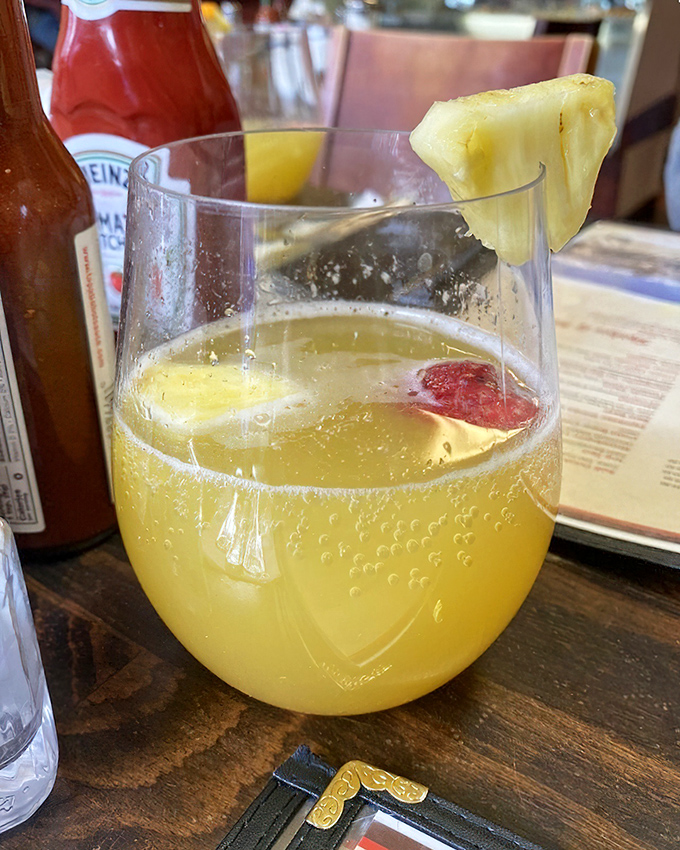 A mimosa garnished with pineapple&mdash;because vacation starts whenever you decide it does. Sunshine in a glass, Eastern Sierra style.