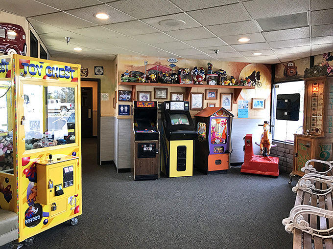 The arcade corner where kids burn energy while adults contemplate second helpings. Those vintage games have witnessed generations of high scores and sticky fingers.