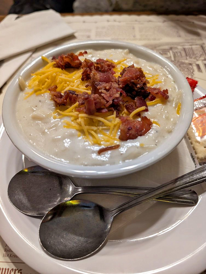 A bowl of potato soup topped with cheese and bacon&mdash;winter comfort that somehow tastes like a warm German kitchen feels.