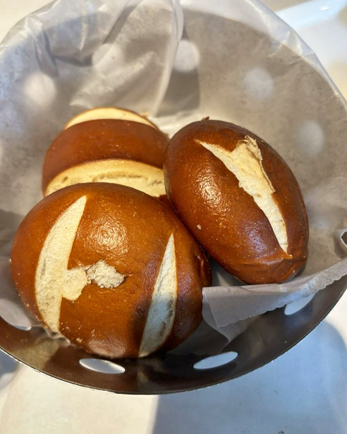 Pretzel rolls so perfectly bronzed they could win a tanning competition in South Beach. Carbs have never looked this good in a supporting role.