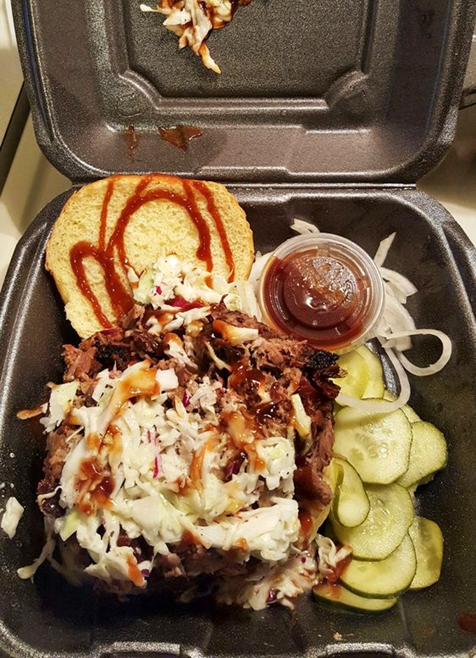 A pulled pork sandwich so loaded, it requires a strategic eating plan and possibly a bib.