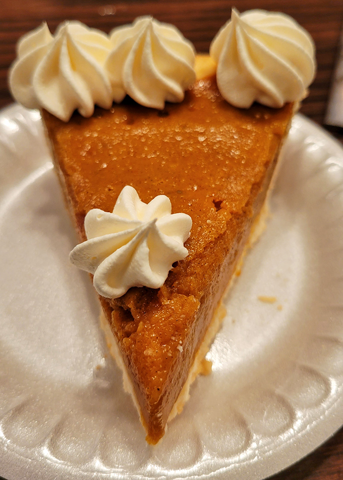 Pumpkin pie with precisely piped whipped cream dollops&mdash;the kind of dessert that makes you consider starting with the last course first.