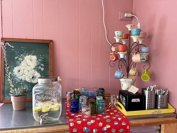 Pink walls, vintage flower art, and a drink station that feels like it's been waiting decades just for you to discover it.