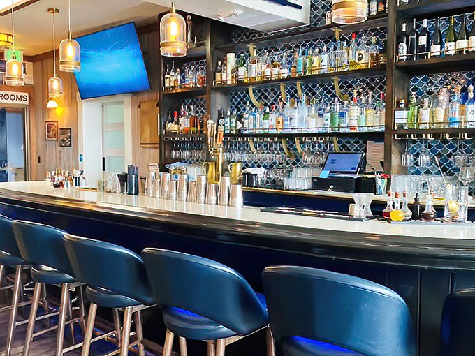 The kind of bar where locals and tourists find common ground over cold drinks and fish tales that grow with each round.