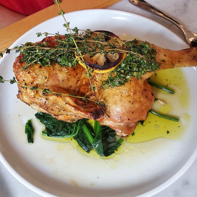 This roasted chicken leg isn't just dinner—it's a masterclass in simplicity. The herb crust and vibrant greens speak volumes.