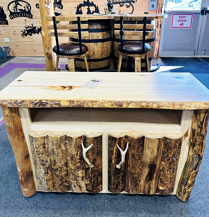 Rustic furniture that screams "mountain lodge chic" without the mountain lodge price tag. Those antler drawer pulls are calling your name.