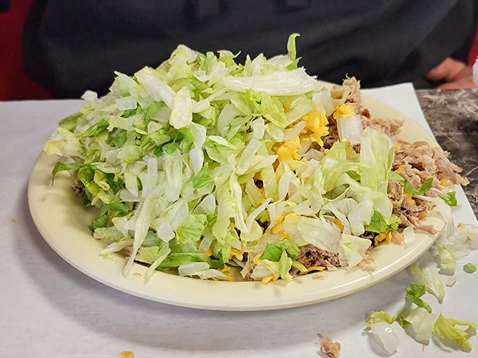When lettuce meets barbecue, it's not a compromise but a canvas &ndash; this mountain of fresh greens topped with smoky meat creates the perfect textural tango.