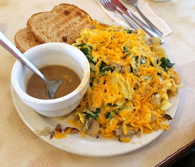 The Scrambler in its natural habitat&mdash;a mountain of potatoes, eggs, and vegetables under an avalanche of cheese that makes vegetables disappear like magic.