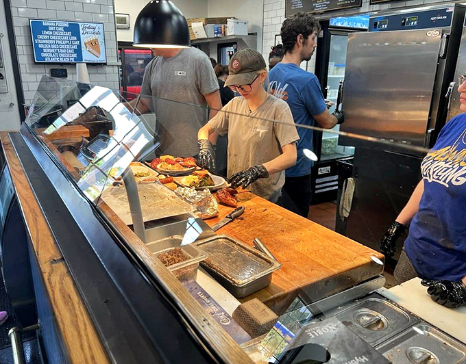 The open service counter lets you watch the magic happen, because transparency in barbecue is always reassuring.