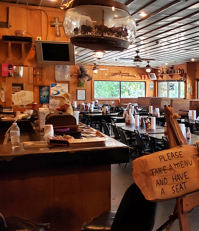 A handwritten "Please take a menu and have a seat" sign tells you everything about the laid-back hospitality you'll experience here.