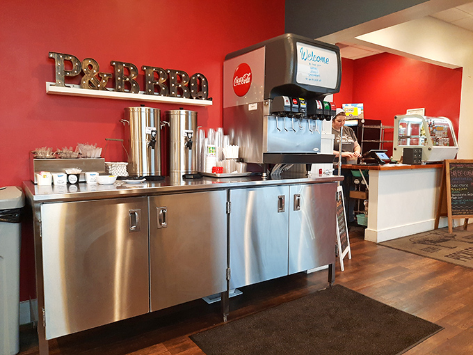 That illuminated "BBQ" sign isn't just decoration&mdash;it's a beacon of hope for the hungry. The stainless steel service area gleams with promise.
