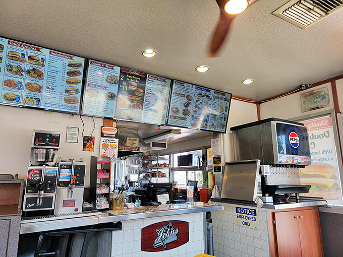 Where the magic happens. That counter has launched more delicious dreams than Hollywood has launched stars. The menu boards: a wall of possibilities.